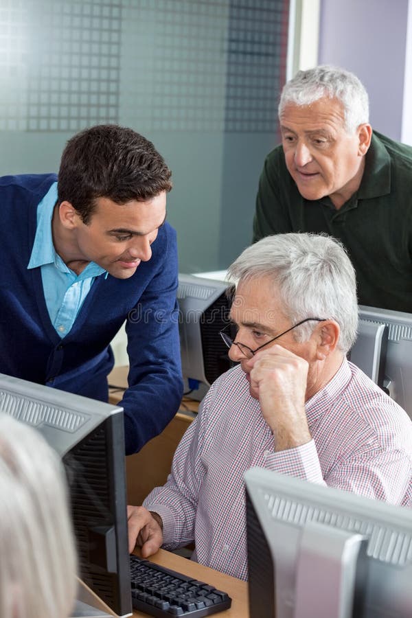 Man Talking With Teacher While Pointing Towards Computer Monitor Stock ...
