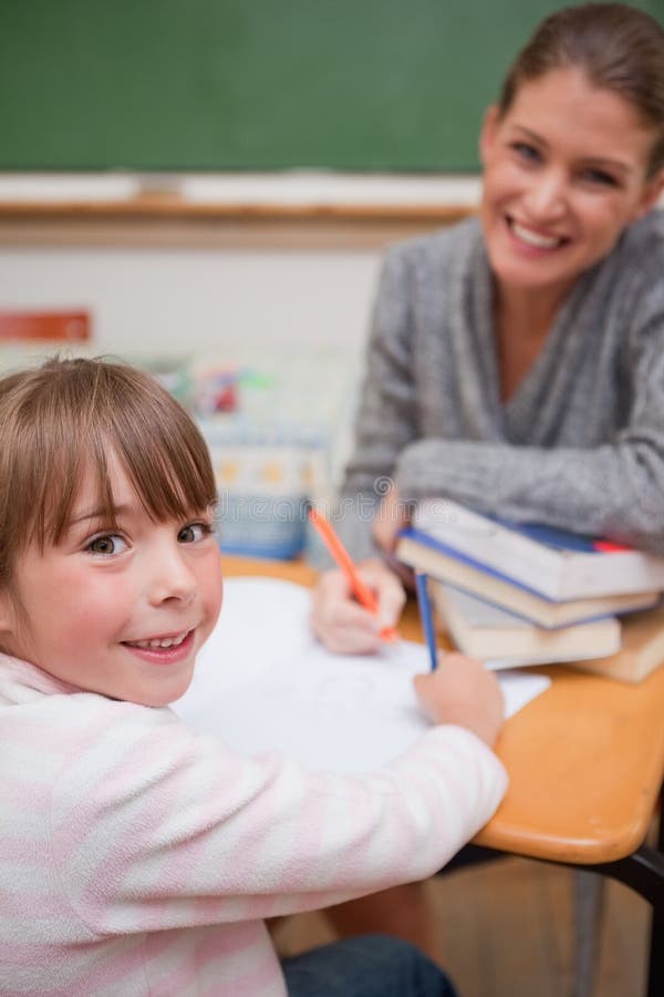 A Teacher Explaining Something To Her Pupil Stock Image - Image of cute ...