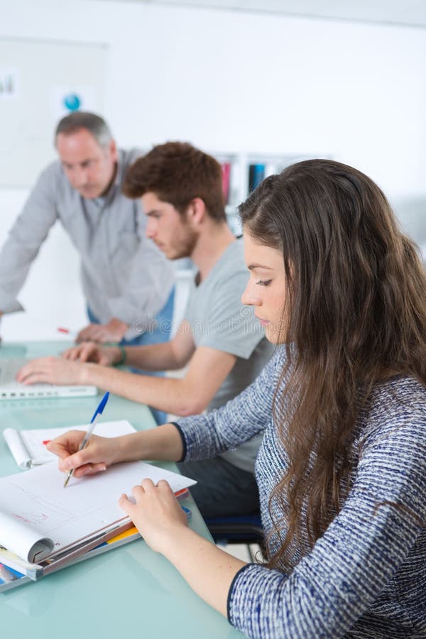 Teacher Explaining Students in Classroom Stock Image - Image of teache ...
