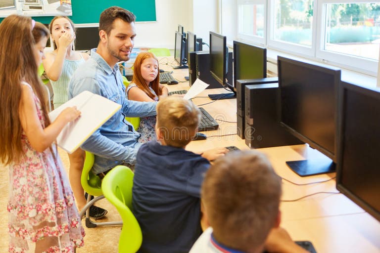 Teacher Explaining Students in Computer Class Stock Image - Image of ...