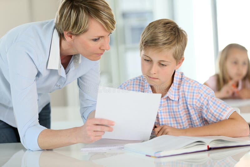 Teacher Explaining To Pupil the Excercise Stock Photo - Image of ...