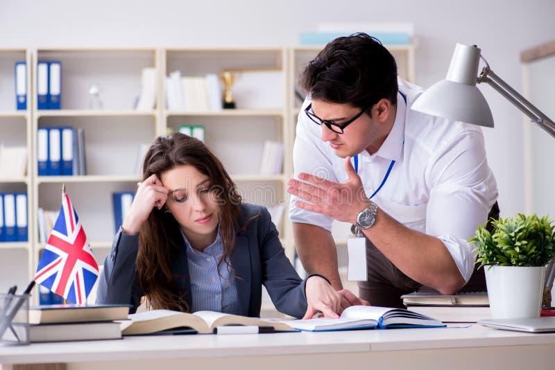 The Teacher Explaining To Student at Language Training Stock Photo ...