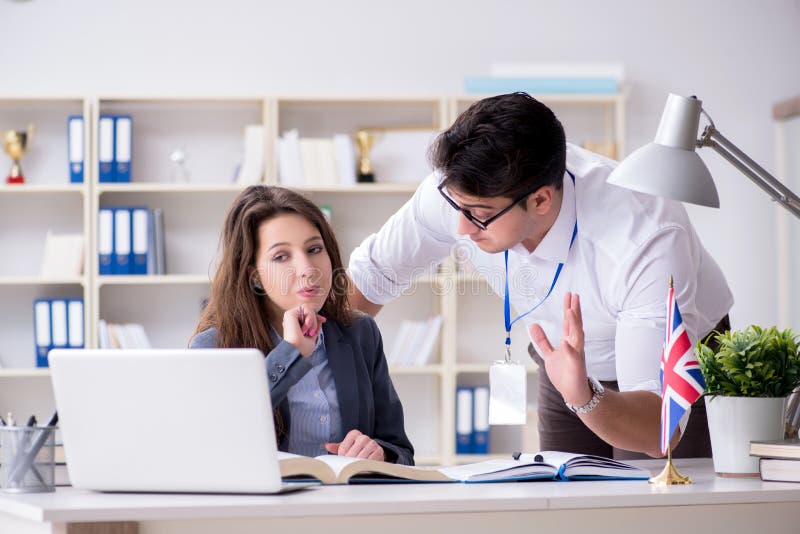 The Teacher Explaining To Student at Language Training Stock Photo ...