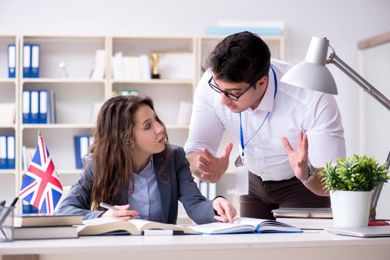 The Teacher Explaining To Student at Language Training Stock Photo ...