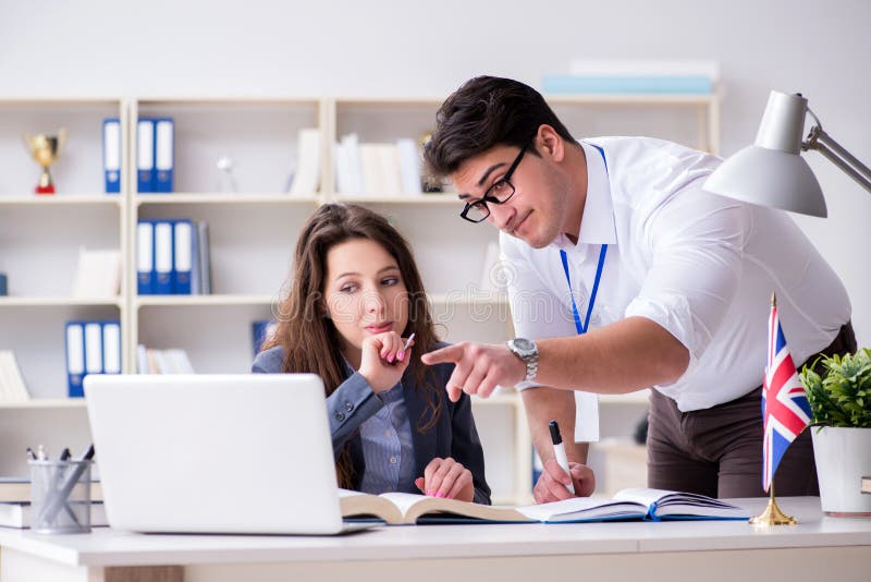 The Teacher Explaining To Student at Language Training Stock Photo ...