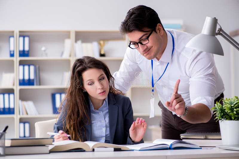 The Teacher Explaining To Student at Lecture Stock Photo - Image of ...