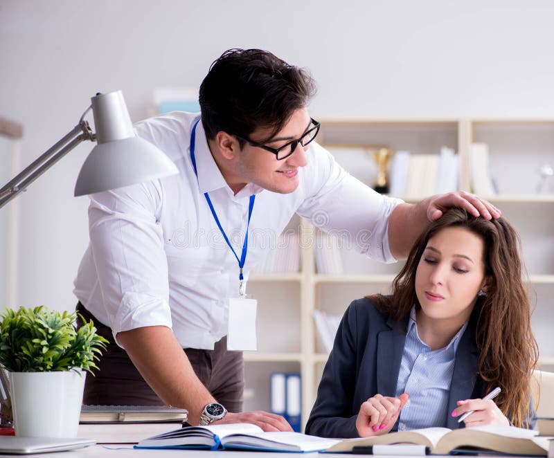 Teacher Explaining To Student at Lecture Stock Photo - Image of girl ...