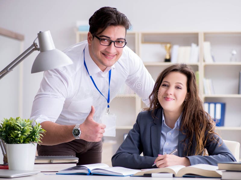 Teacher Explaining To Student at Lecture Stock Photo - Image of primary ...