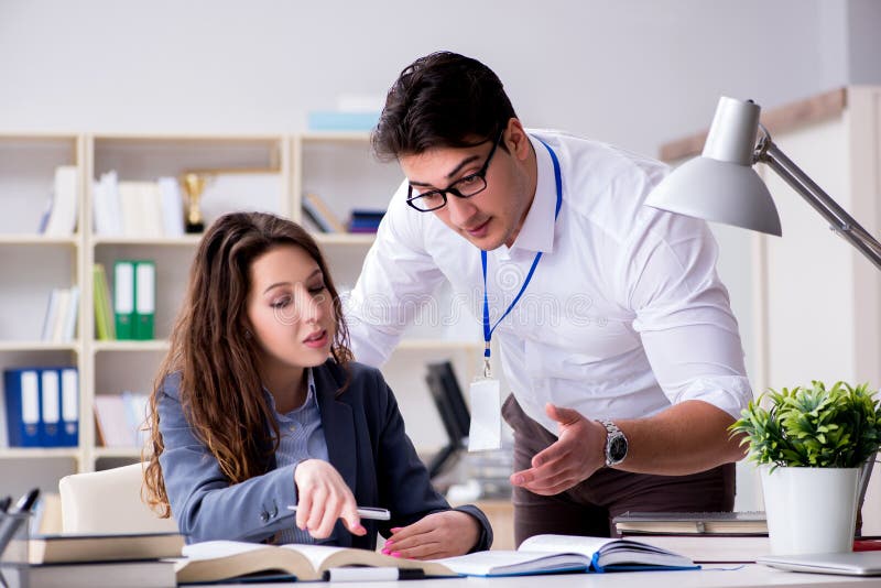 The Teacher Explaining To Student at Lecture Stock Photo - Image of ...