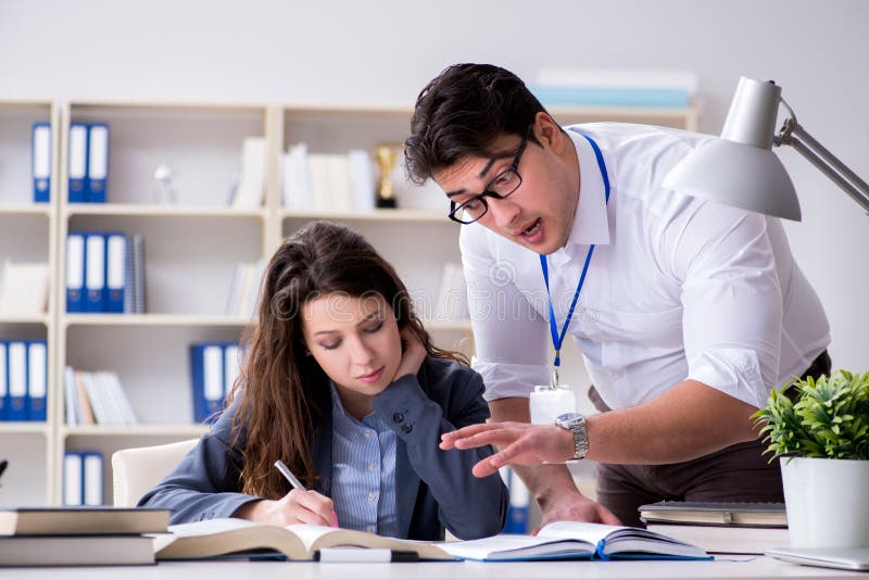 The Teacher Explaining To Student at Lecture Stock Image - Image of ...