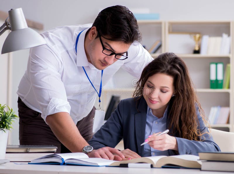 Teacher Explaining To Student at Lecture Stock Image - Image of boss ...