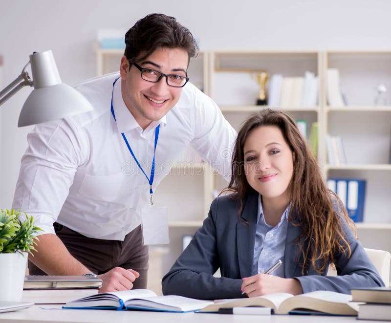 Teacher Explaining To Student at Lecture Stock Image - Image of ...