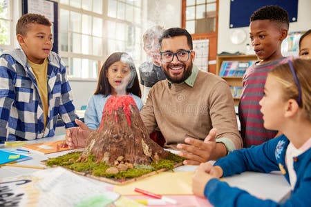 Teacher Explaining Volcano Eruption To Elementary Class Stock Image ...