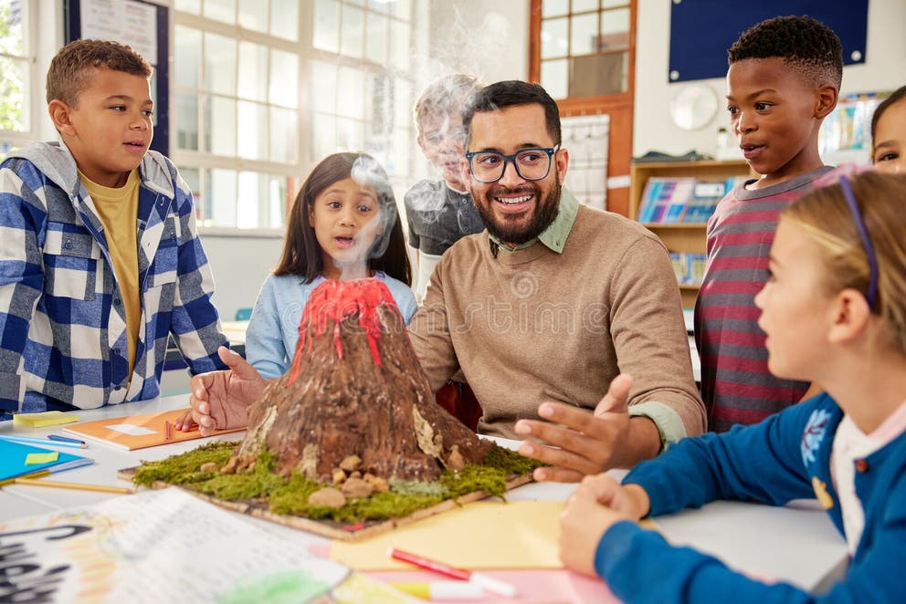 Teacher Explaining Volcano Eruption To Elementary Class Stock Image ...