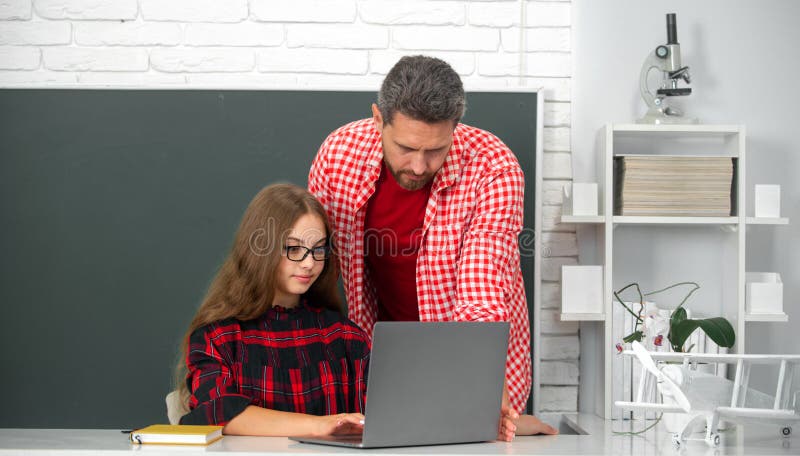 Teacher Explains Lesson To School Child. Elementary School Kids ...