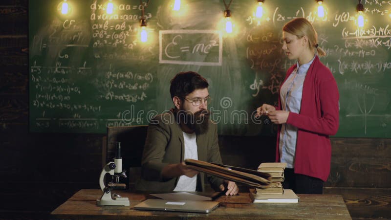 Teacher Explanation Math. Couple Professors. Female Student Thinking in ...