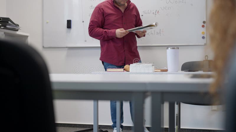 A Teacher is Facilitating a Classroom Discussion in a Contemporary ...