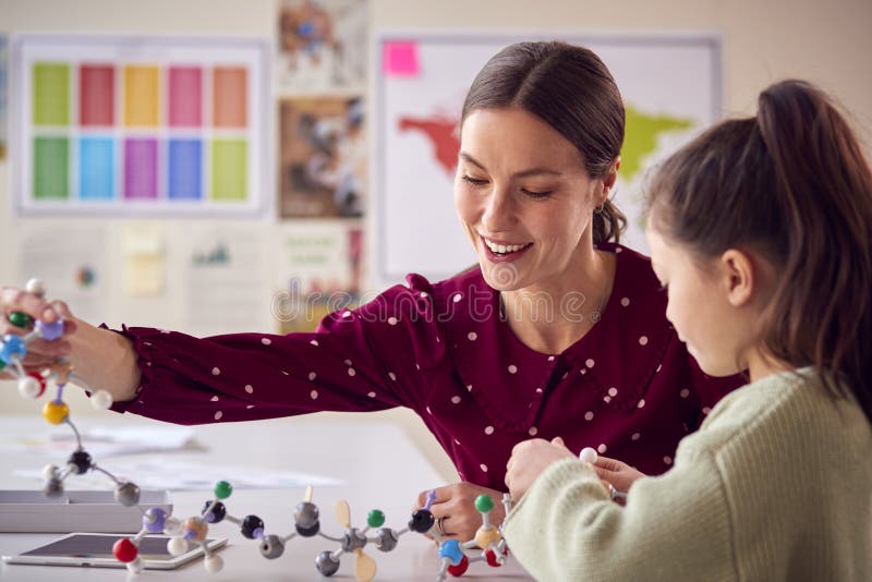 Teacher and Female Student in School Science Class Studying Molecular ...