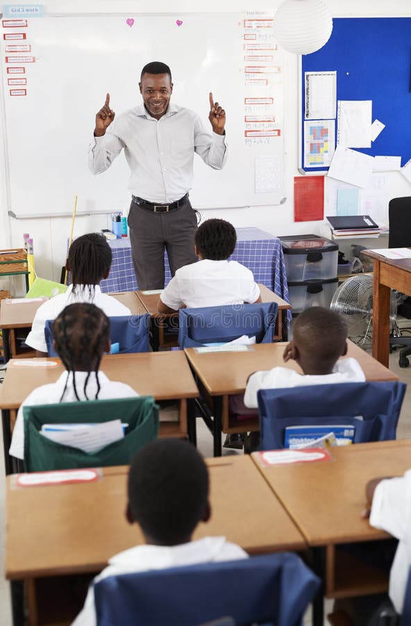 Teacher in Front of Classroom of Elementary School Kids Stock Image ...