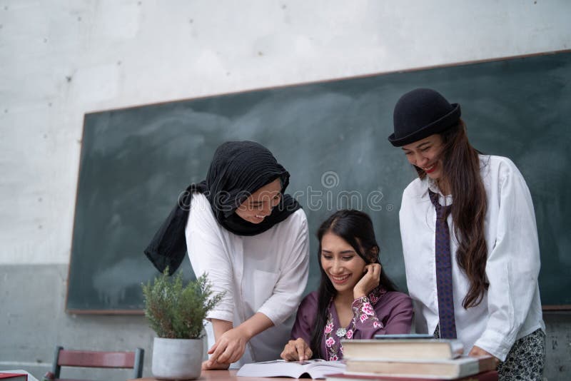 Teacher Gathering in a Classroom Stock Photo - Image of smiling, group ...
