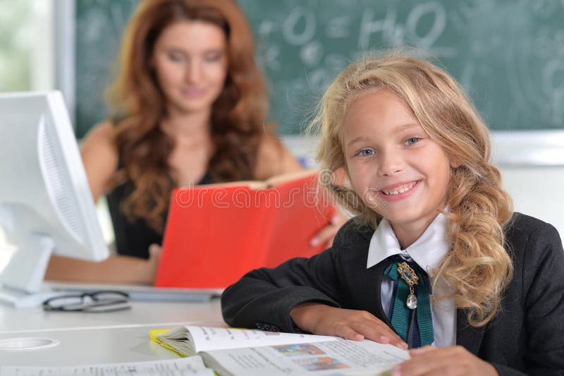 Teacher with Girl at Lesson Stock Image - Image of grade, classroom ...