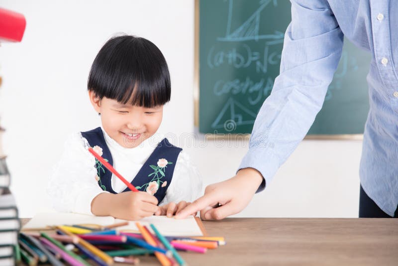 The Teacher Gives Student Homework Stock Photo - Image of listening ...