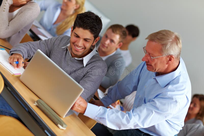 Teacher Giving Assistance in Class Stock Image - Image of student ...