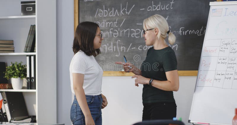 Teacher Giving Instruction To Student Stock Image - Image of teaching ...