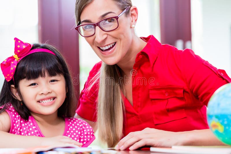 Teacher Giving Language Lessons To Chinese Child Stock Photo - Image of ...