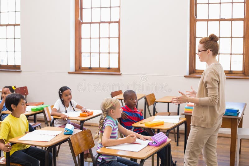 Teacher Giving a Lesson in Classroom Stock Image - Image of interacting ...