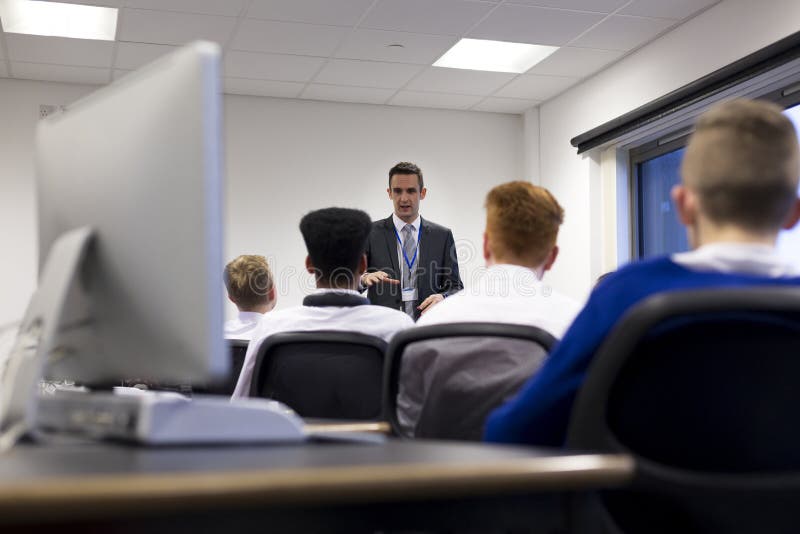 Teacher Giving a Lesson stock image. Image of uniform - 72542855