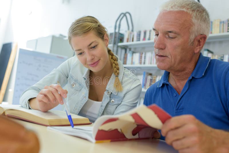 Teacher Giving Private Lessons To Woman Stock Photo - Image of smart ...