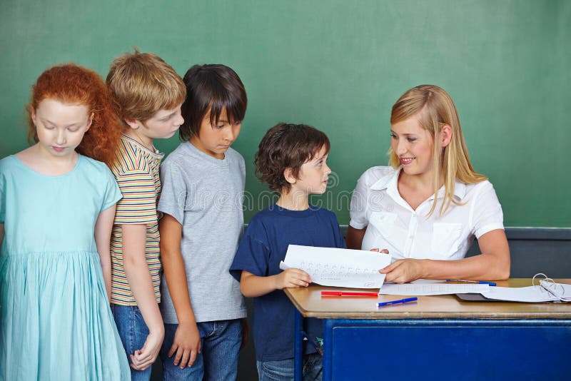 Teacher Grading Tests for Students Stock Photo - Image of lessons, test ...