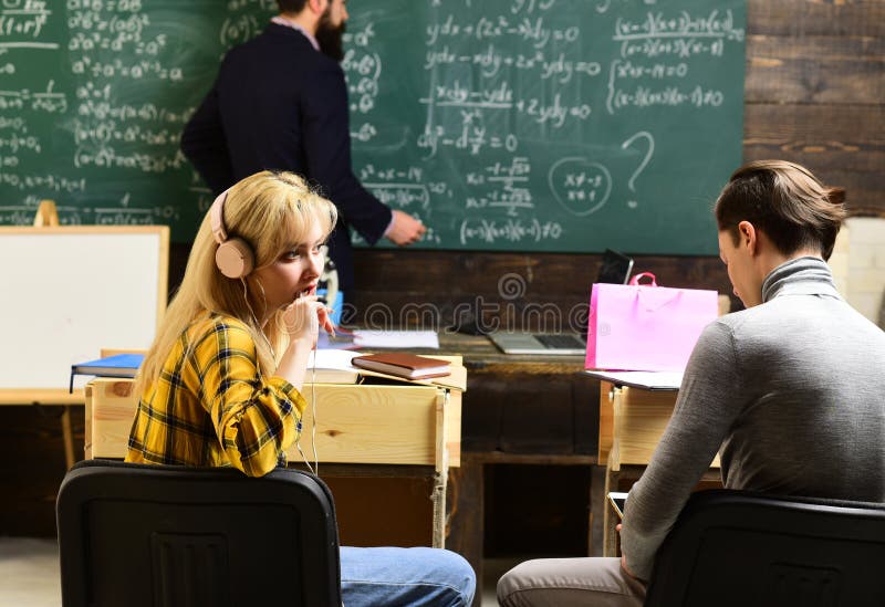 Teacher in Glasses Reading Reports of Talented Students Correcting ...