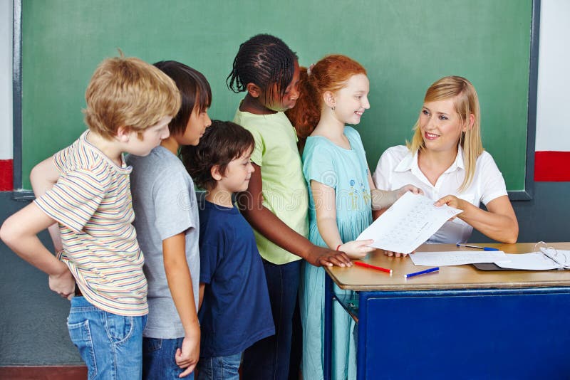 Teacher Grading Tests for Students Stock Photo - Image of lessons, test ...