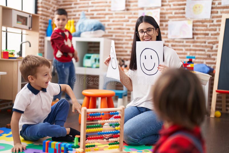 Teacher with Group of Boys Sitting on Table Having Emotion Therapy at ...