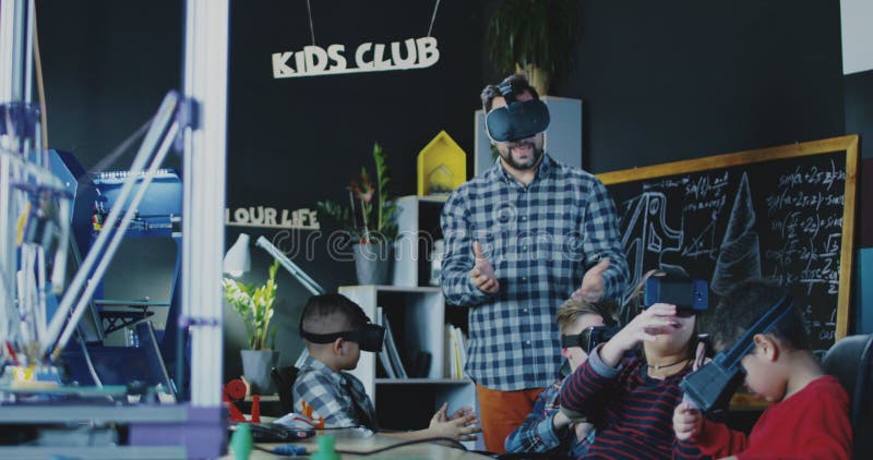 Kids with Teacher Exploring VR Technology Stock Image - Image of ...