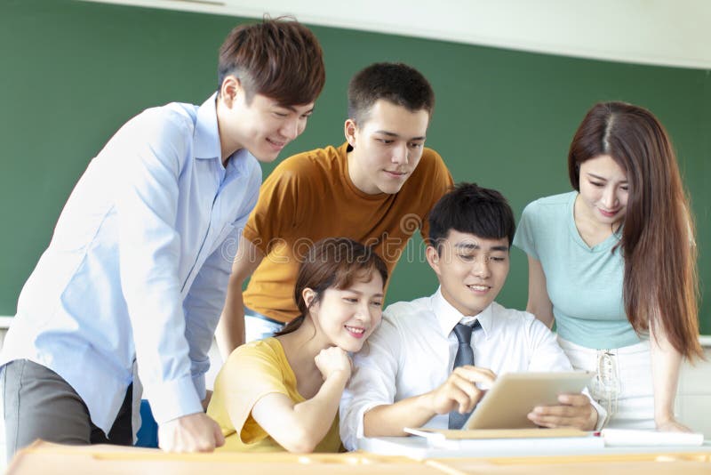 Teacher with Group of College Students in Classroom Stock Photo - Image ...