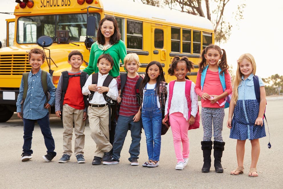 Teacher and a Group of Elementary School Kids at a Bus Stop Stock Image ...