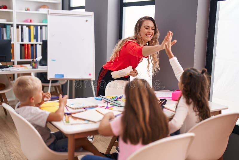 Teacher and Group of Kids Having Space Lesson High Five at Classroom ...