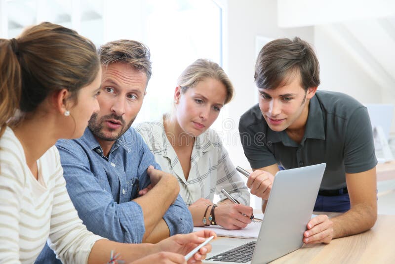 Teacher with Group of Students in Class Working on Laptop Stock Image ...