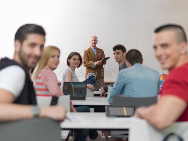 Teacher with a Group of Students in Classroom Stock Photo - Image of ...