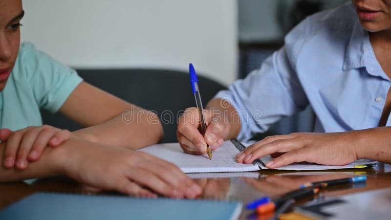 Teacher Guiding Student in Writing Practice during Back To School ...