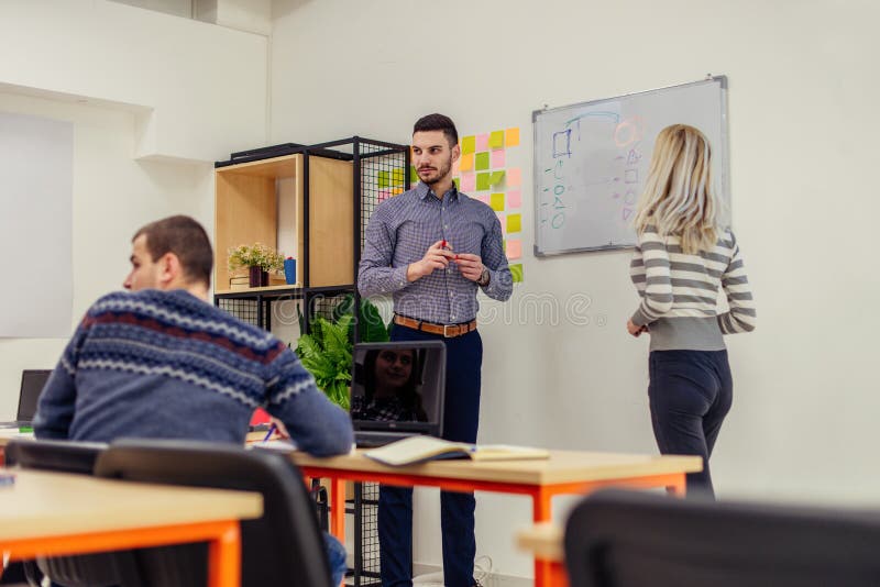 Teacher having a lecture stock image. Image of friends - 146193507