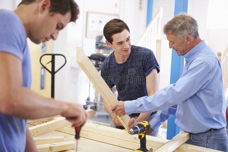 Teacher Helping College Student Studying Carpentry Stock Image - Image ...