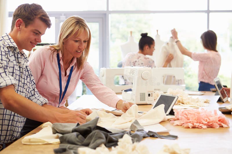Teacher Helping College Students Studying Fashion and Design Stock ...