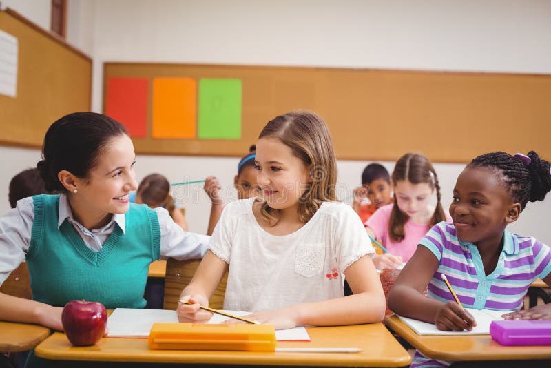 Teacher Helping Pupils during Class Stock Photo - Image of academic ...