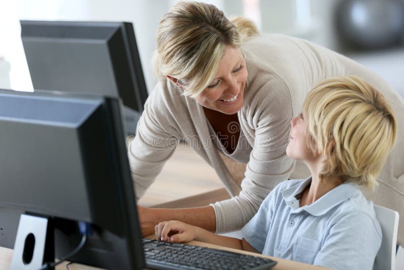 Teacher with Kids in Front of Computer Stock Image - Image of lesson ...