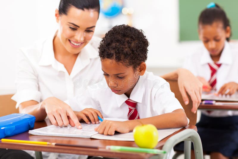 Teacher helping student stock photo. Image of cute, elementary - 29287500
