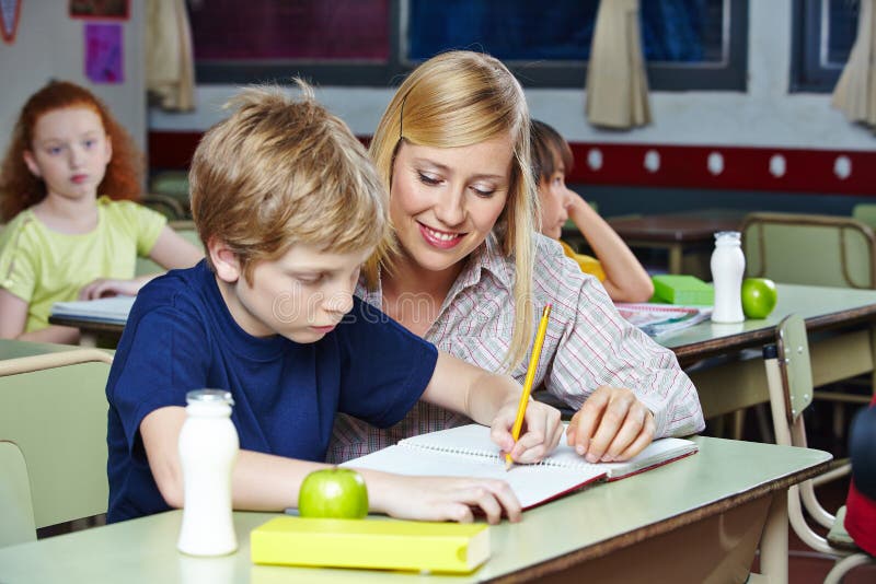 Teacher Helping Students In Class Stock Photo - Image of teacher ...